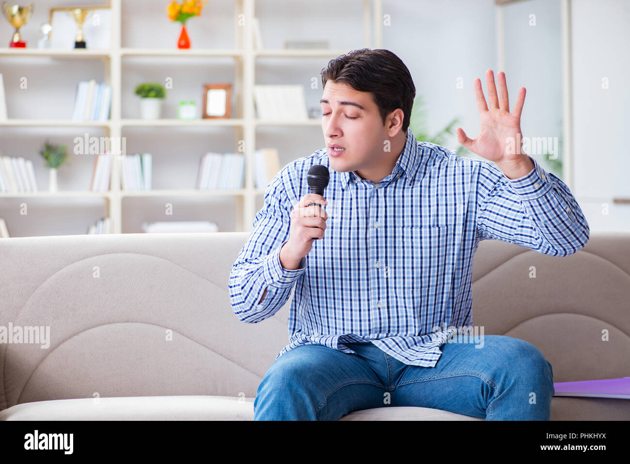 Funny man singing songs in karaoke at home Stock Photo - Alamy
