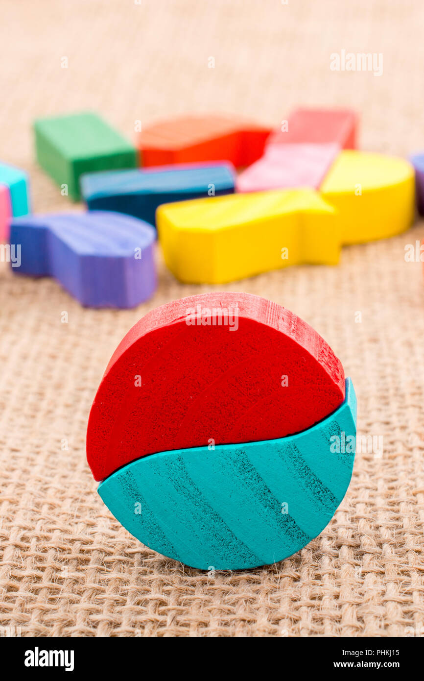 Colorful wooden pieces of a logic puzzle Stock Photo - Alamy