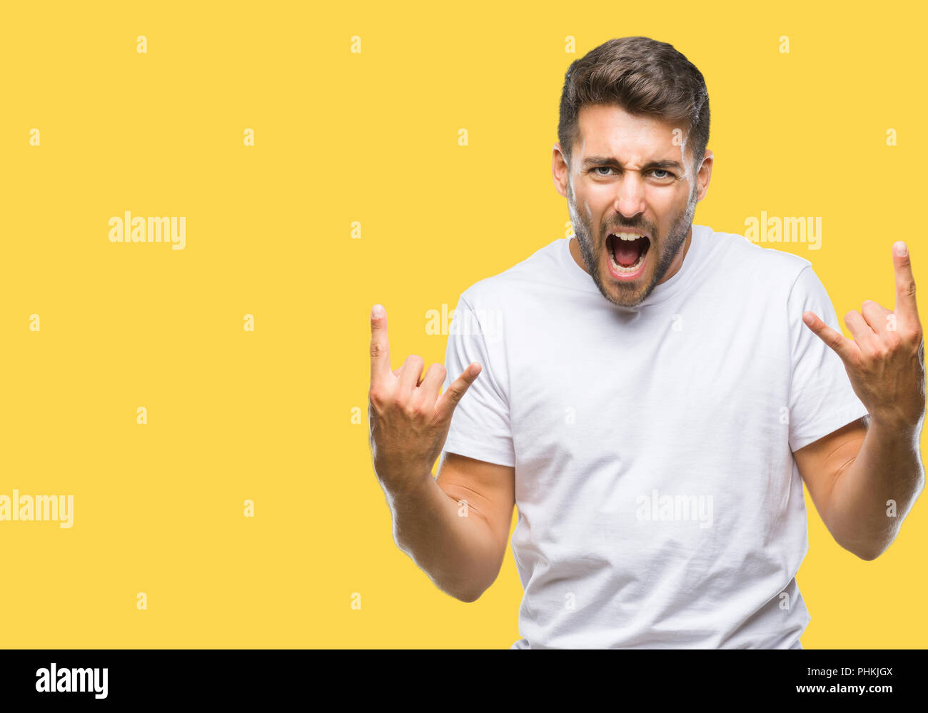 Young handsome man over isolated background shouting with crazy ...