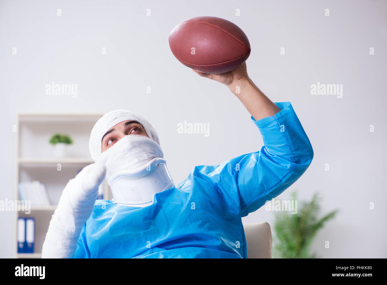 Injured american football player recovering in hospital Stock Photo - Alamy