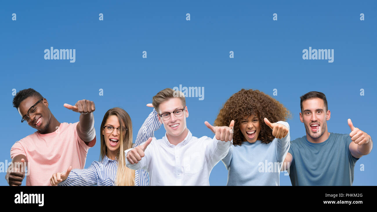 Composition of group of friends over blue blackground approving doing ...