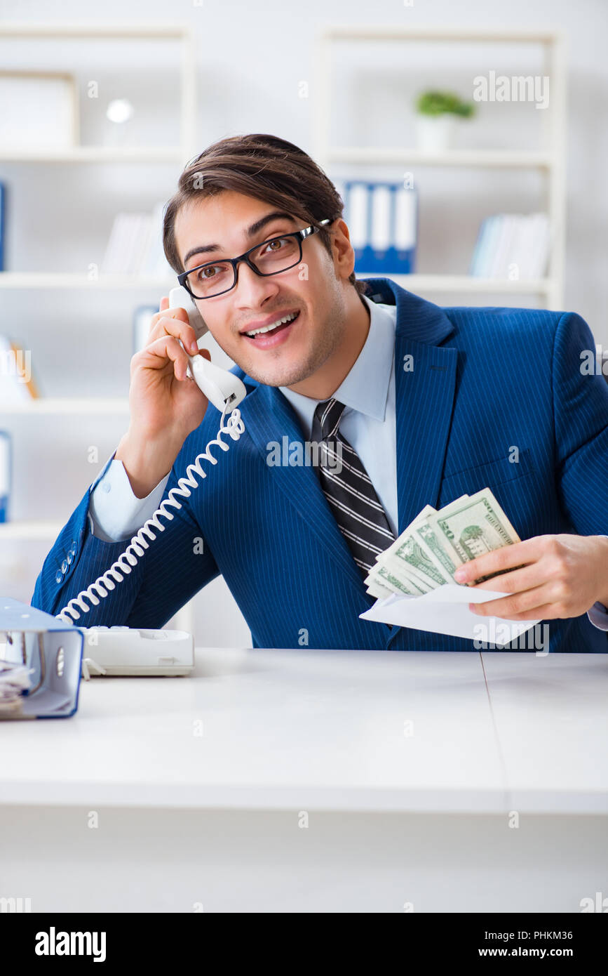 Businessman receiving his salary and bonus Stock Photo - Alamy