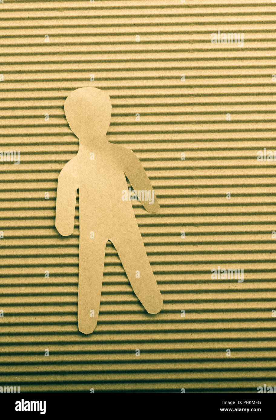 Man shape cut out of paper in hand in the view Stock Photo - Alamy