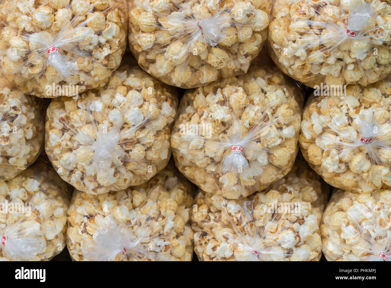 Stacked plastic-packed popcorn Stock Photo - Alamy