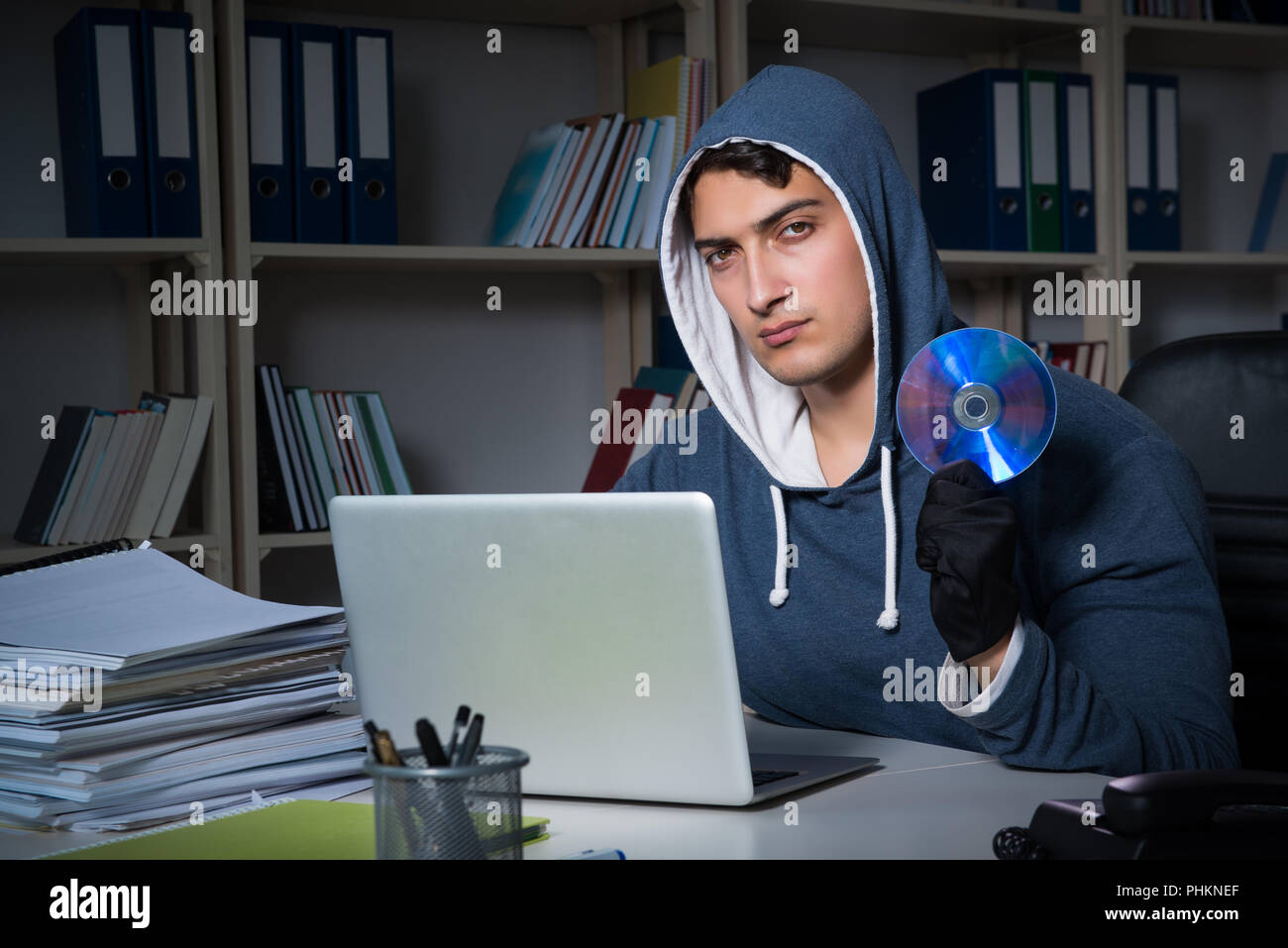 Young hacker hacking into computer at night Stock Photo - Alamy