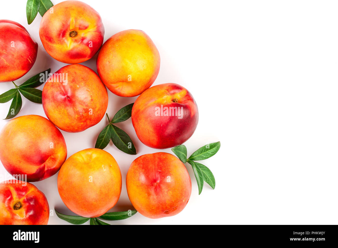 ripe nectarine with leaves isolated on white background with copy space ...
