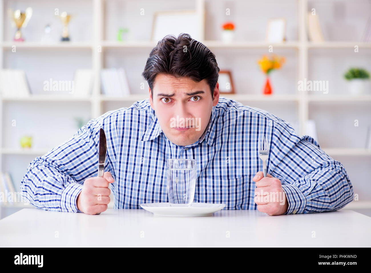 Angry man waiting food in hi-res stock photography and images - Alamy