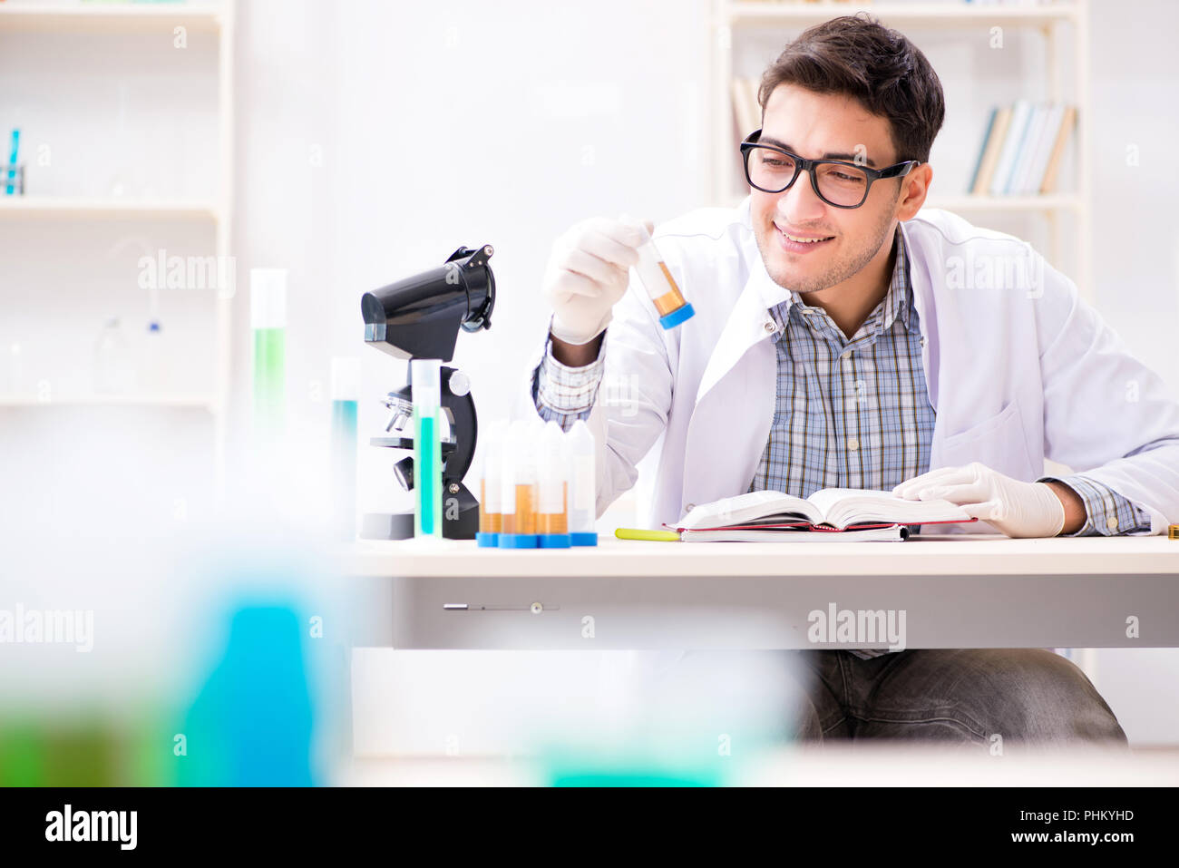 Chemistry student doing chemical experiments at classroom activi Stock ...