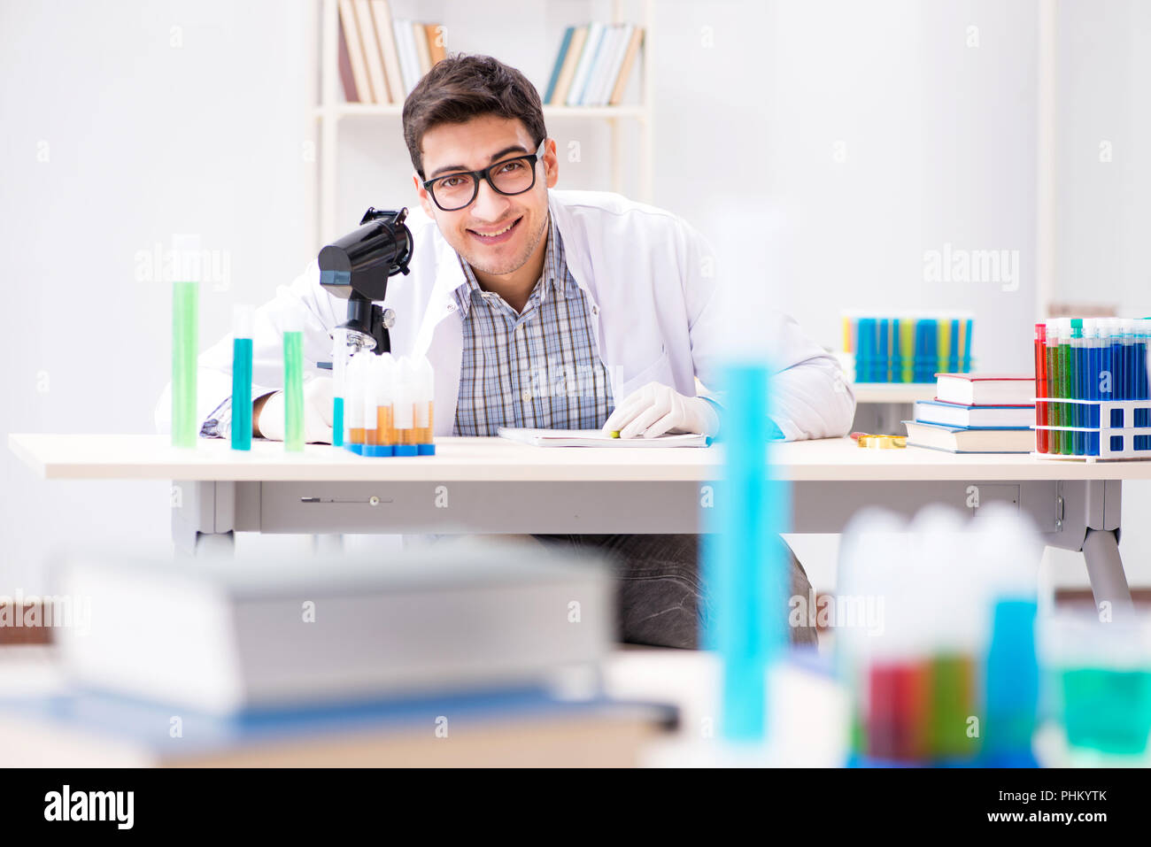 Chemistry student doing chemical experiments at classroom activi Stock ...