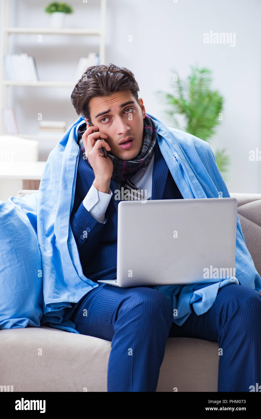 Sick businessman working from home due to flu sickness Stock Photo - Alamy