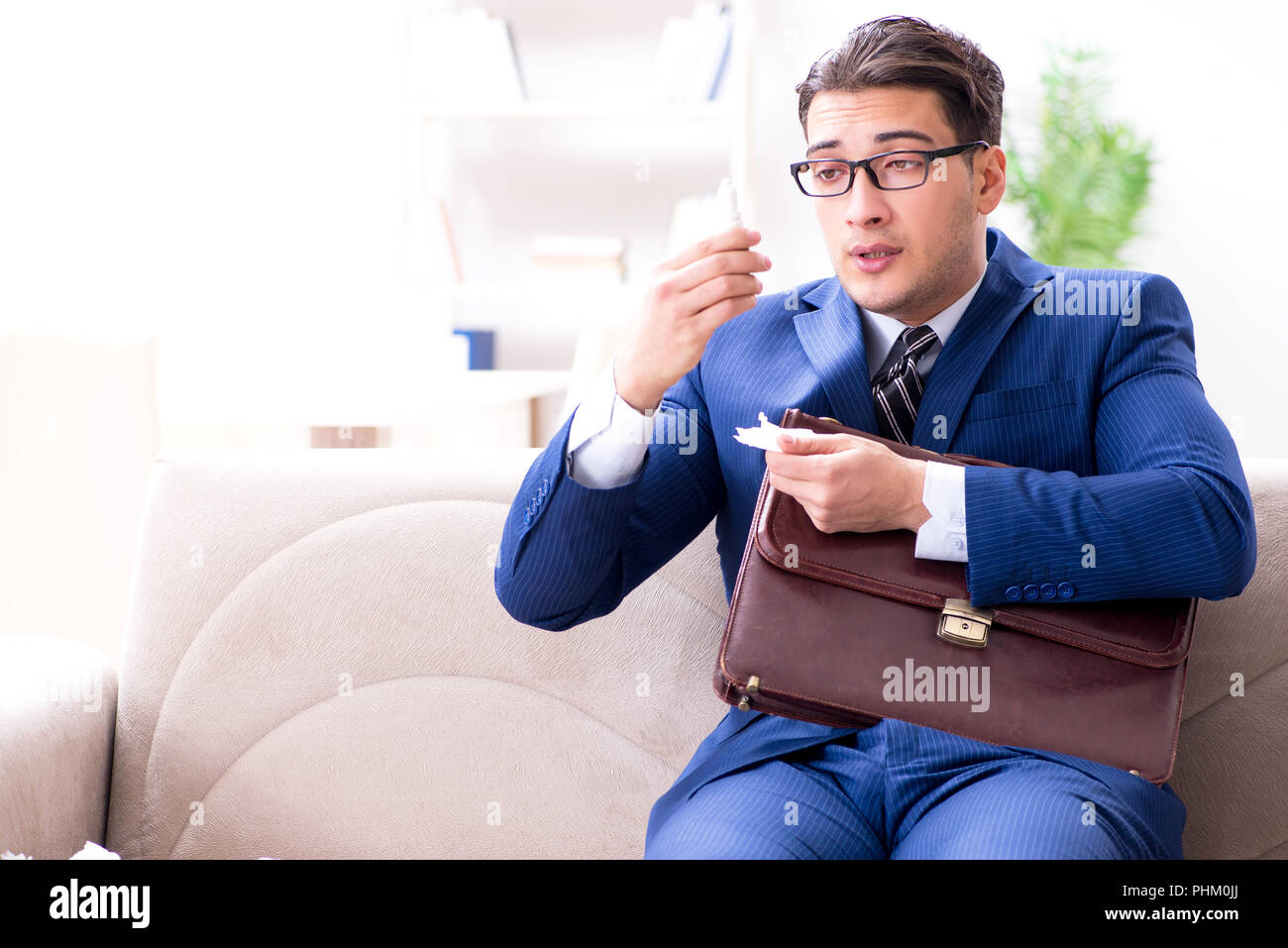 Sick employee staying at home suffering from flue Stock Photo - Alamy