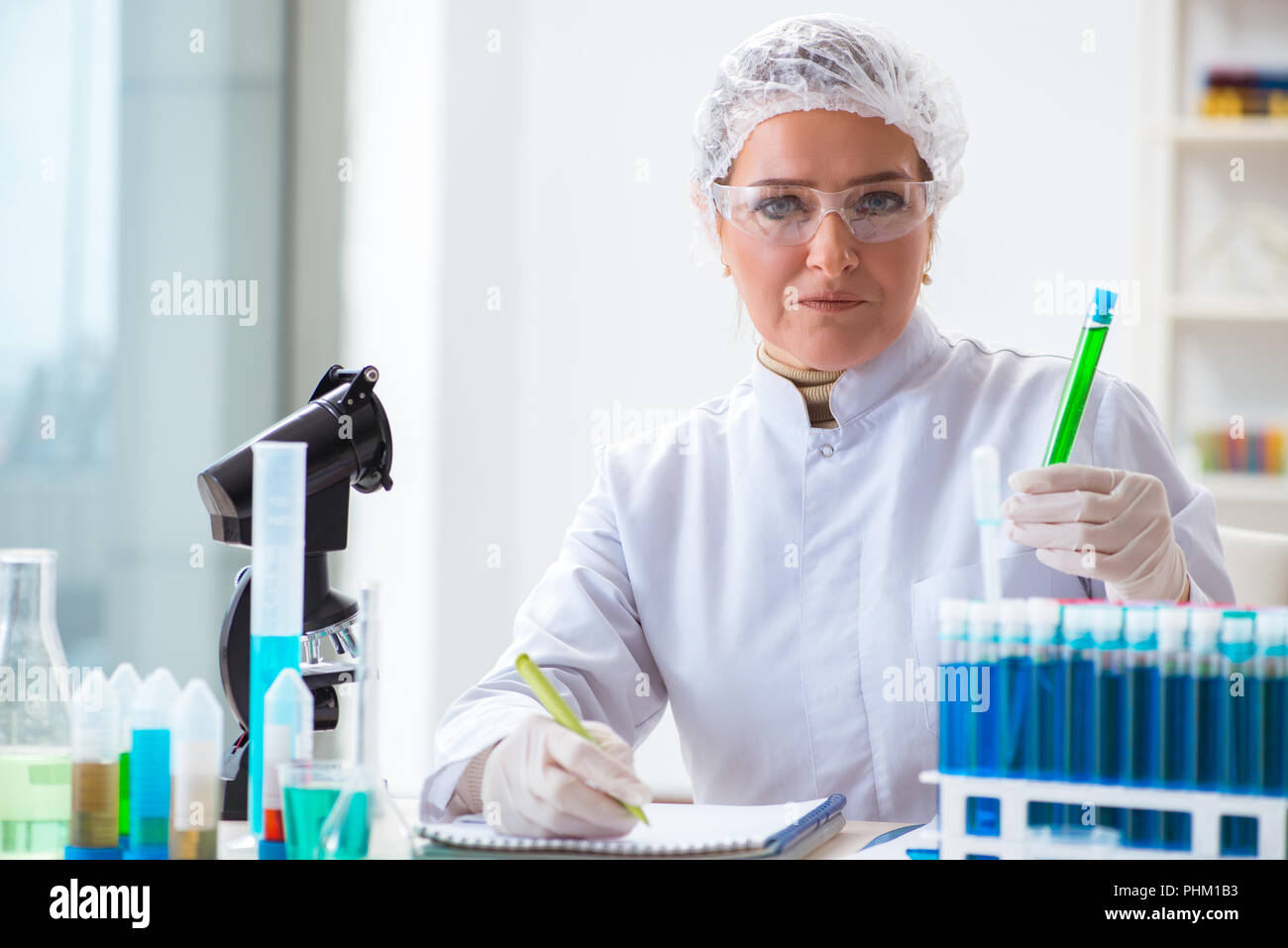 Woman chemist working in hospital clinic lab Stock Photo - Alamy