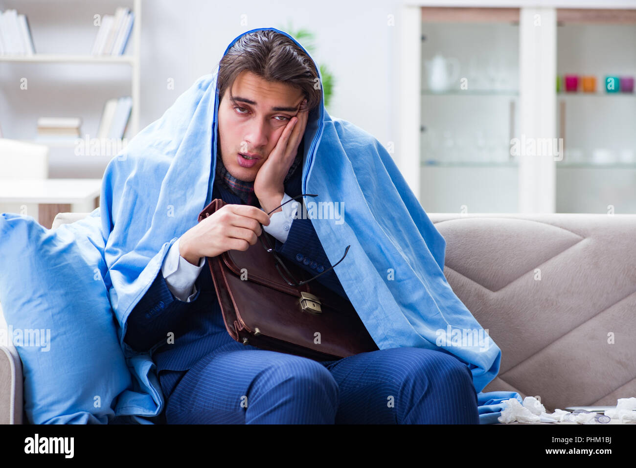 Sick employee staying at home suffering from flue Stock Photo - Alamy