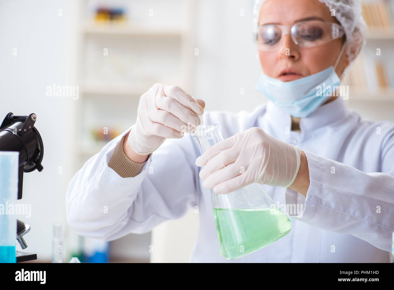 Woman chemist working in hospital clinic lab Stock Photo - Alamy