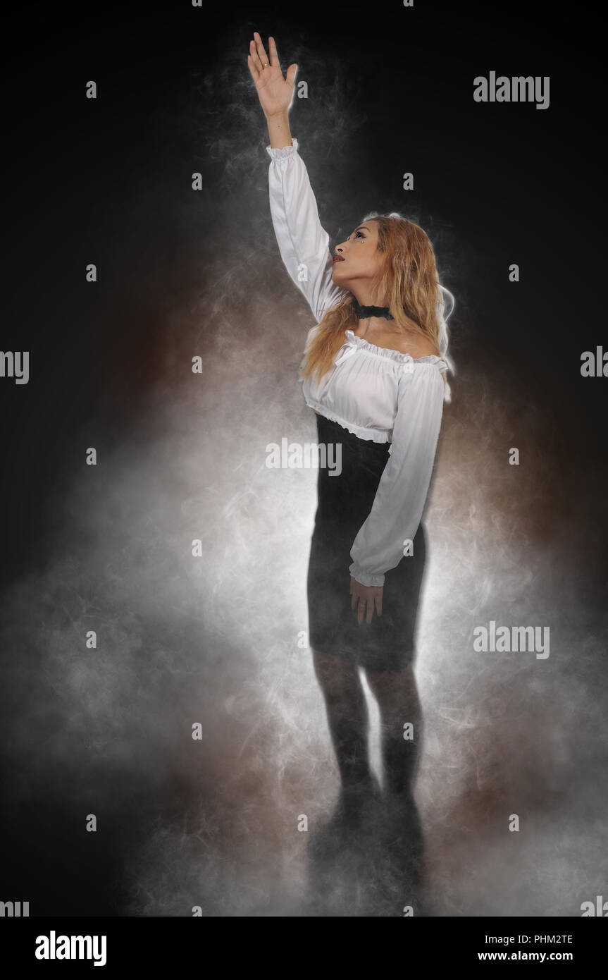 Beautiful woman pointing Stock Photo - Alamy