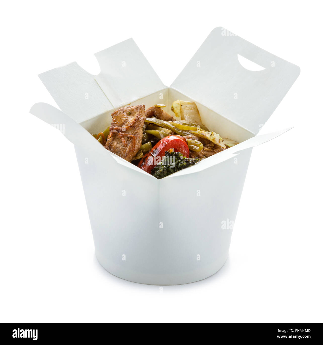 Spinach noodles with chicken and vegetables in take-out box over white ...