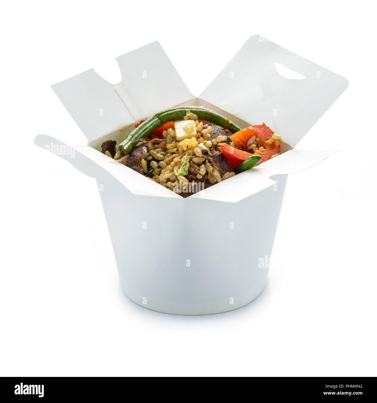 Wok rice with duck and vegetables in take-out box over white background ...