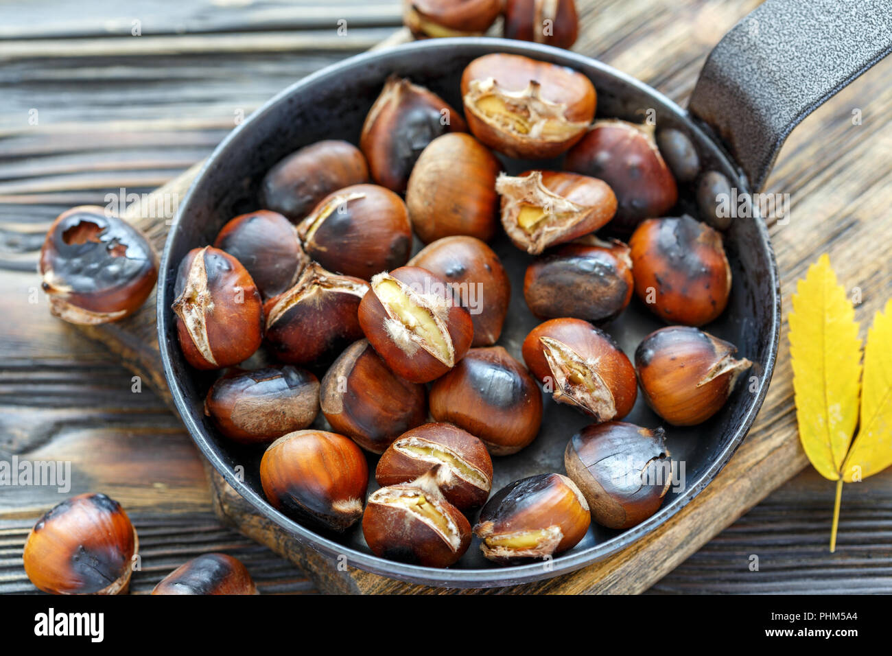 Roast chestnuts in a pan closeup Stock Photo - Alamy