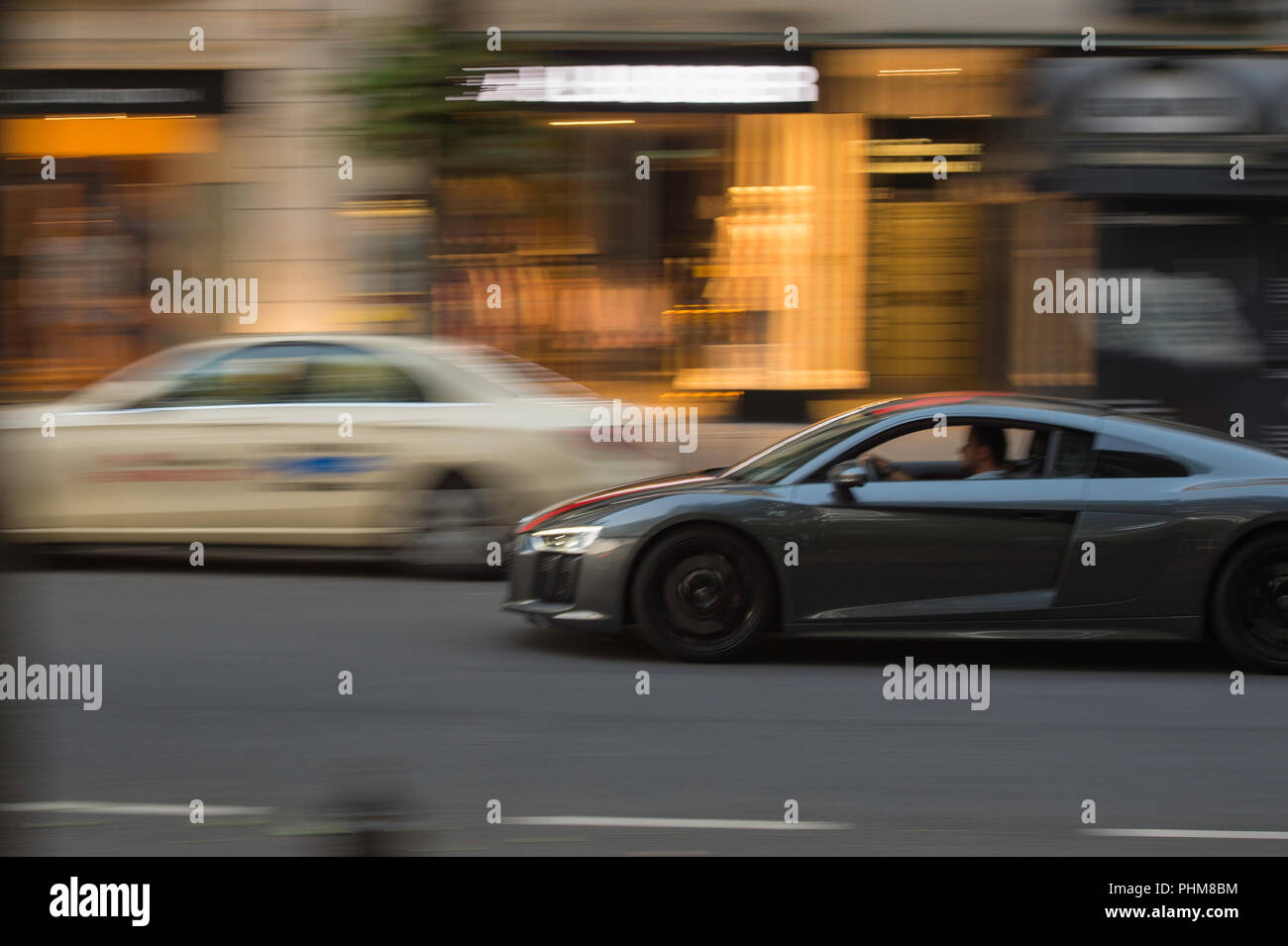 A car moving at speed with a blur effect on the background and vehicle ...