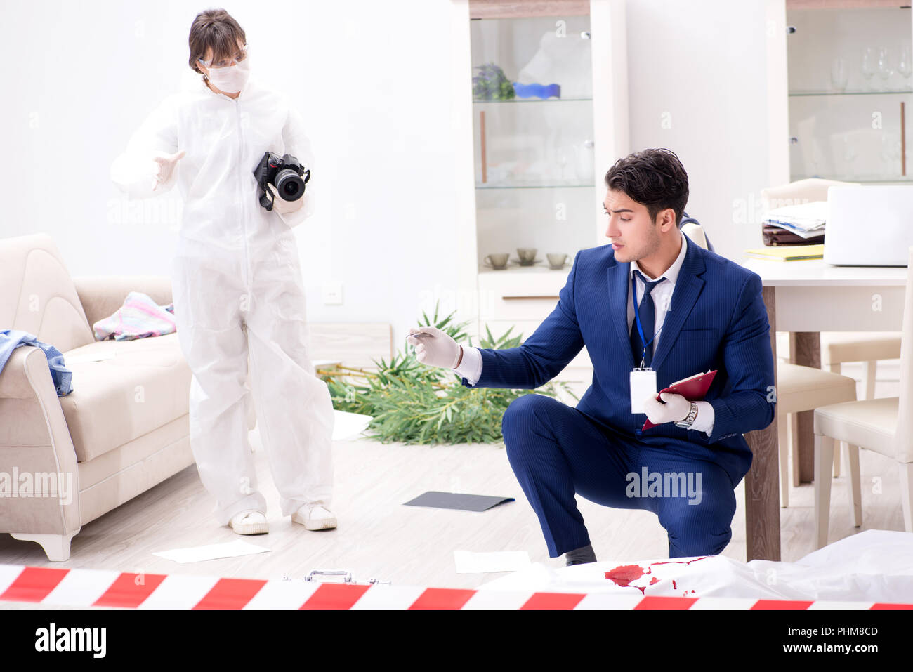 Forensics investigator at the scene of office crime Stock Photo - Alamy
