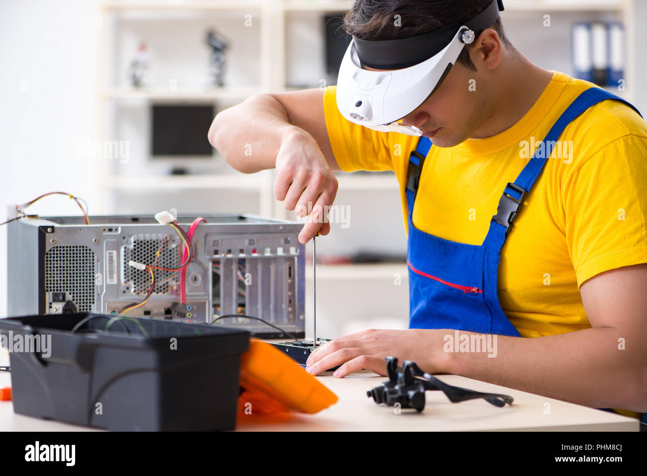 Computer repair technician repairing hardware Stock Photo - Alamy
