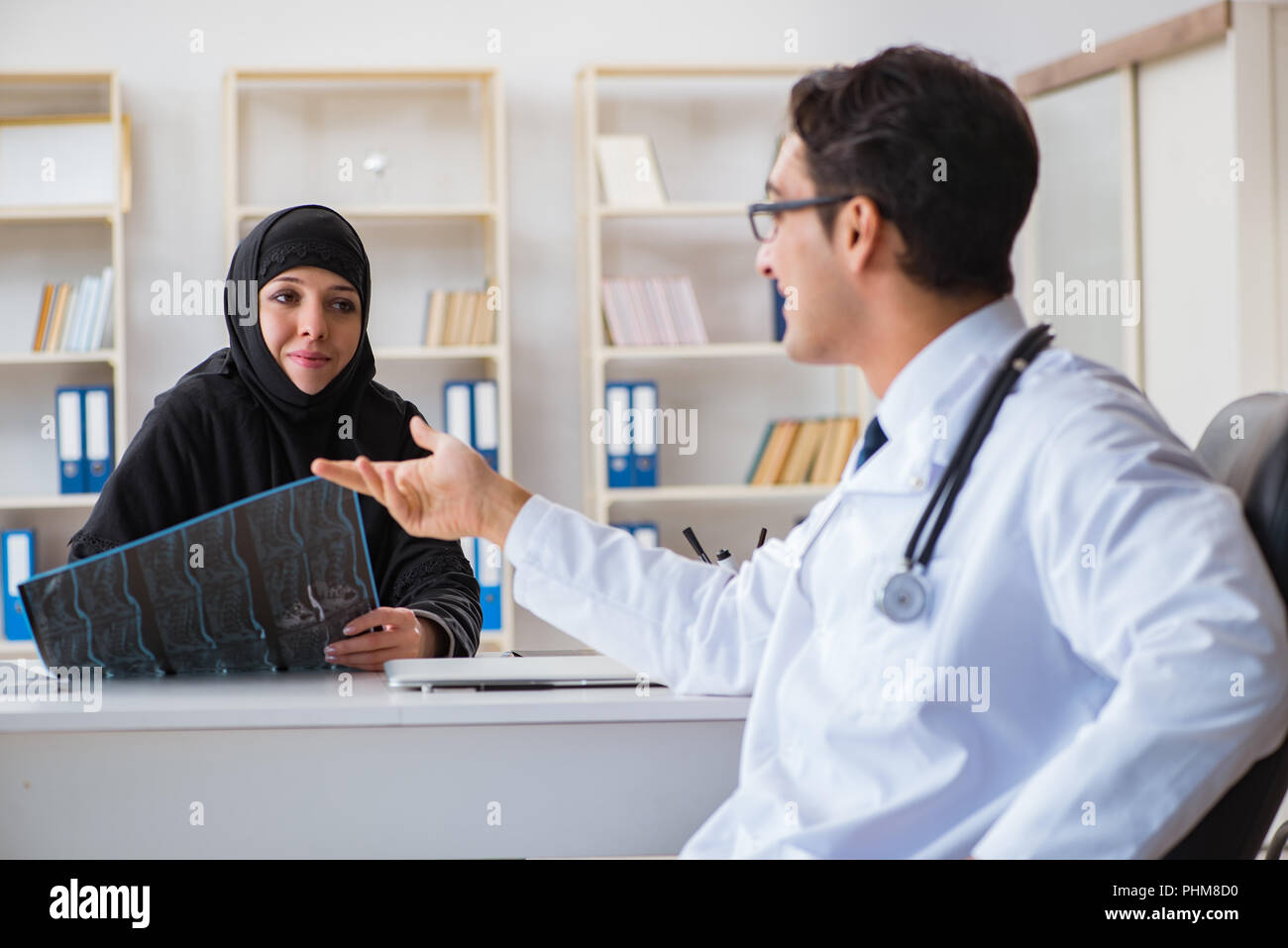 Muslim woman visiting doctor for regular check-up Stock Photo - Alamy