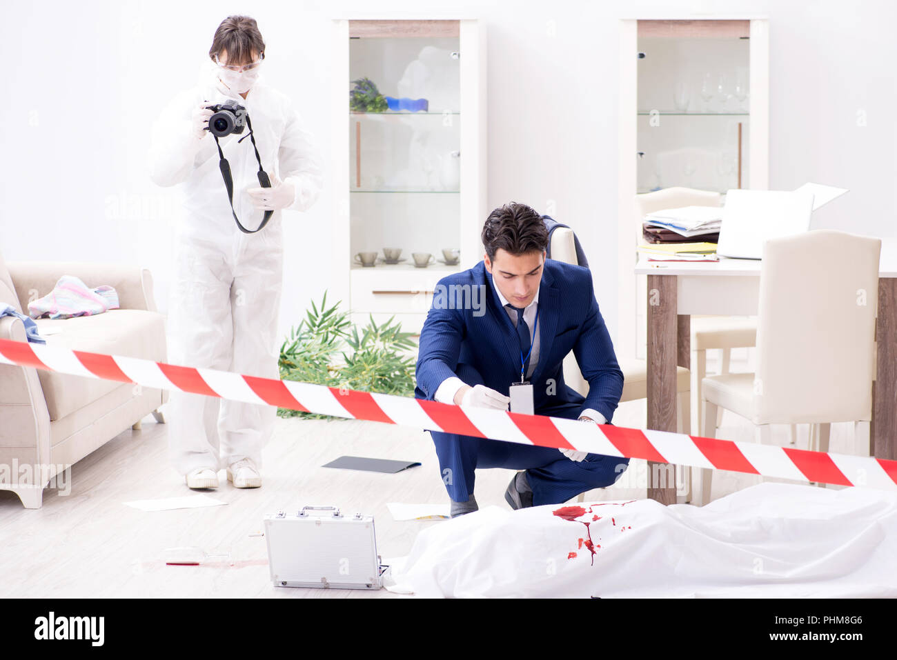 Forensics investigator at the scene of office crime Stock Photo - Alamy