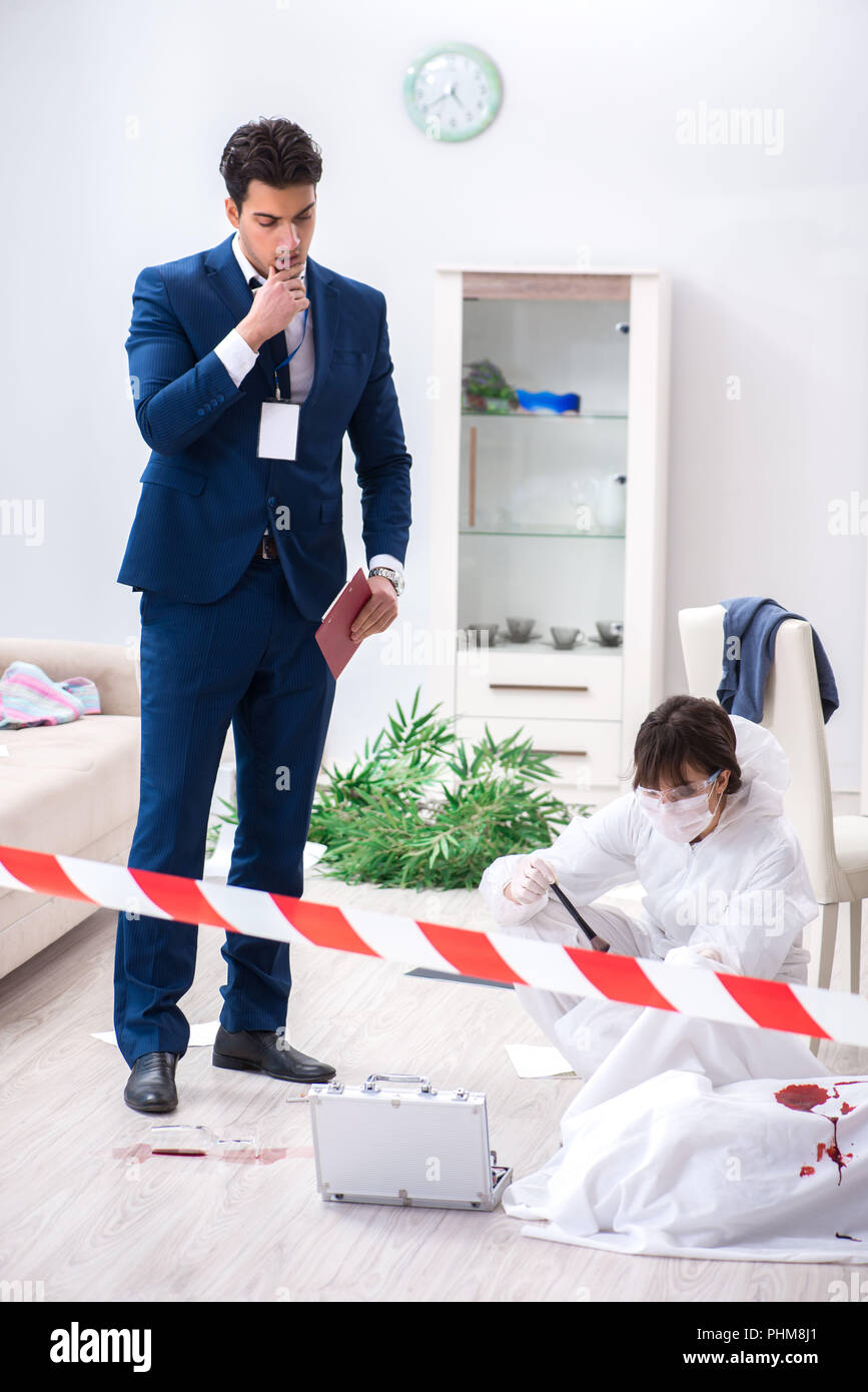 Forensics investigator at the scene of office crime Stock Photo - Alamy