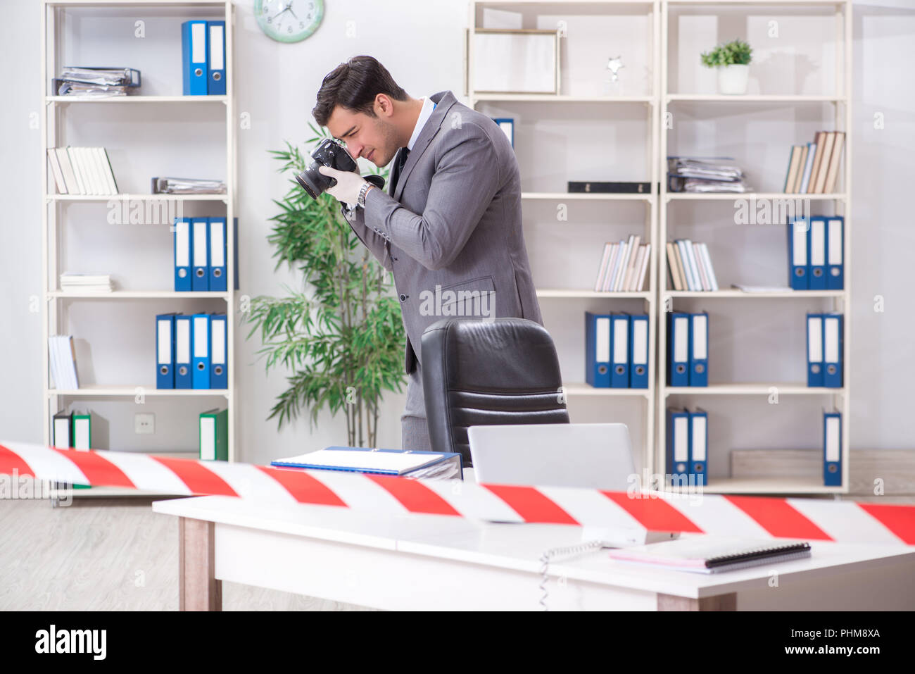 Forensics investigator at the scene of office crime Stock Photo - Alamy