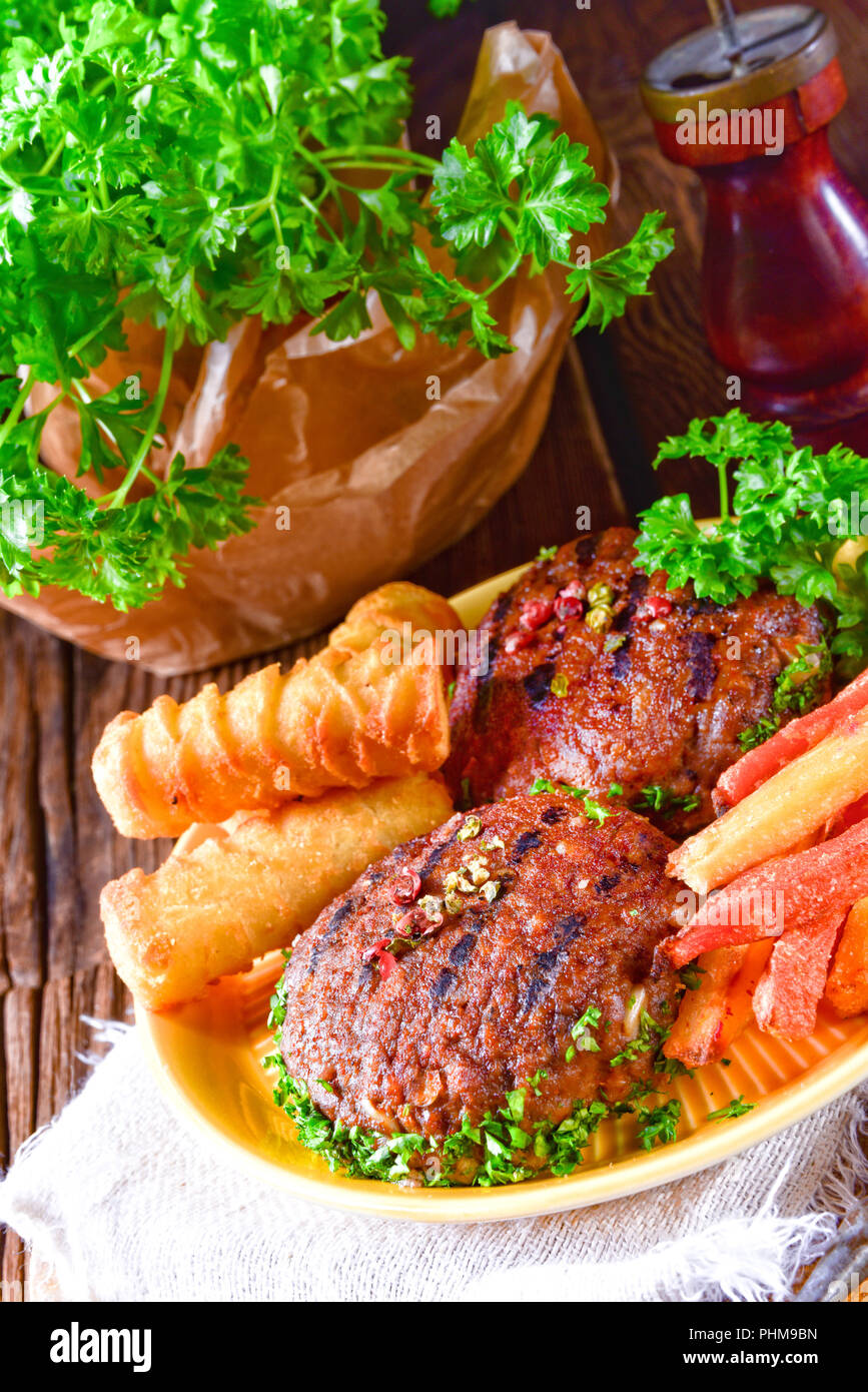 grilled bullets with croquettes and vegetables Stock Photo - Alamy