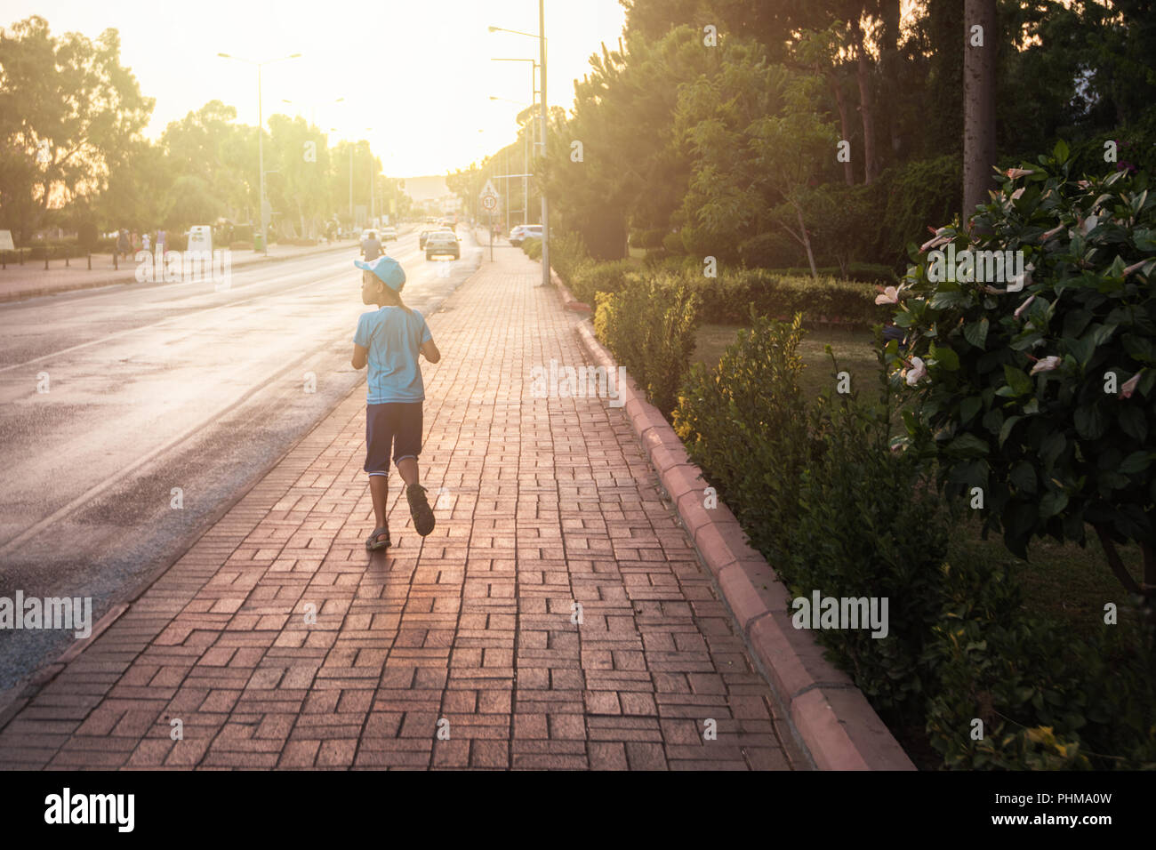 Kid boy walking Stock Photo - Alamy