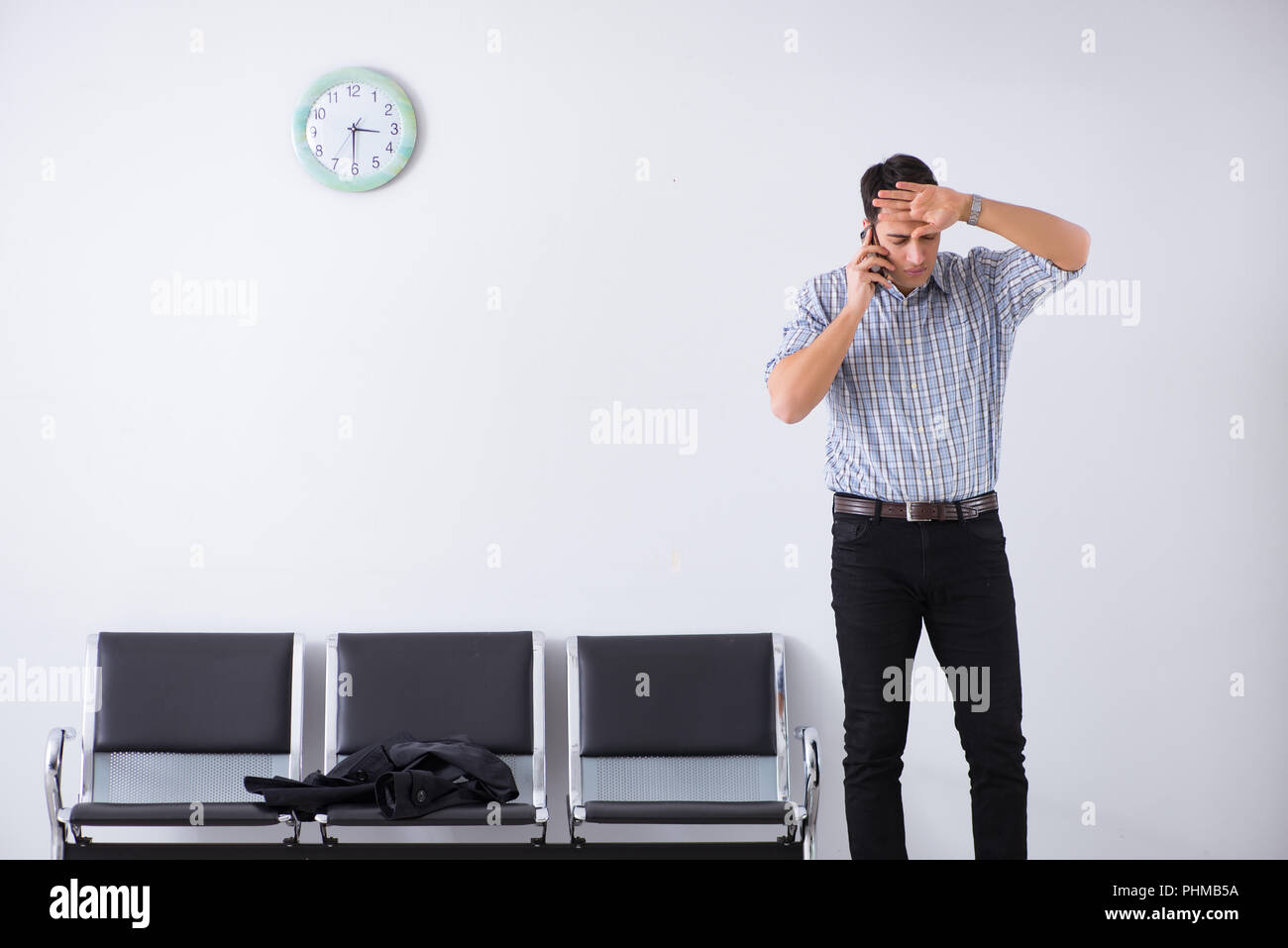 Man nervously impatiently waiting in the lobby Stock Photo - Alamy