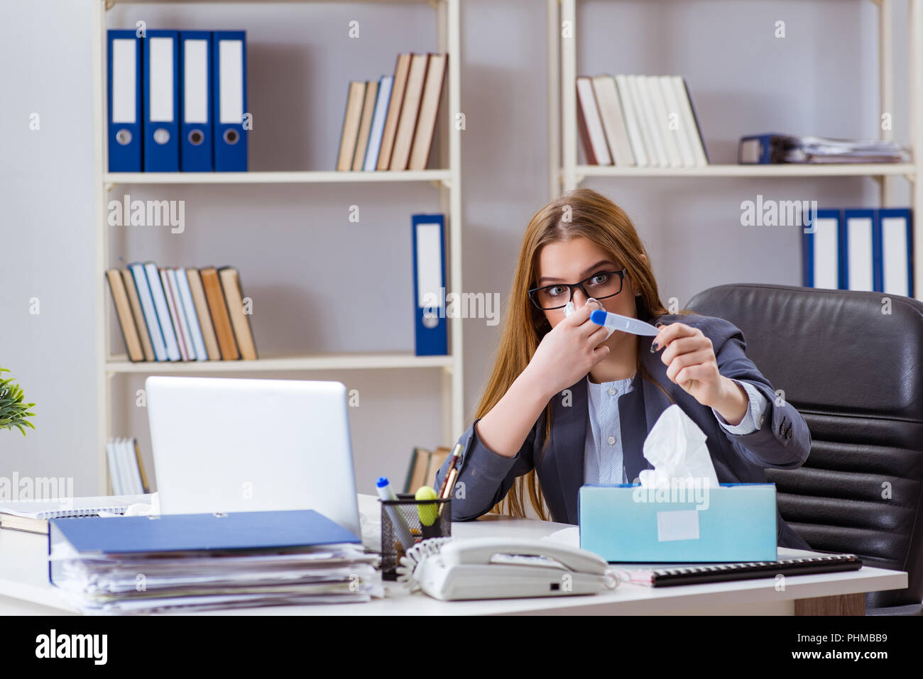 Businesswoman employee sick in the office Stock Photo - Alamy
