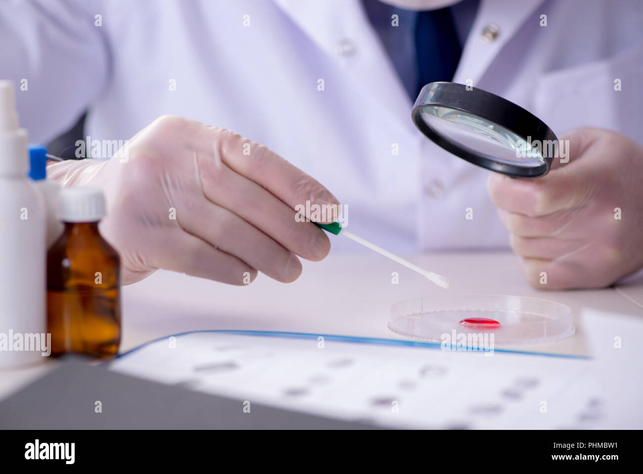 Drug synthesis lab experimentnig with pills Stock Photo - Alamy