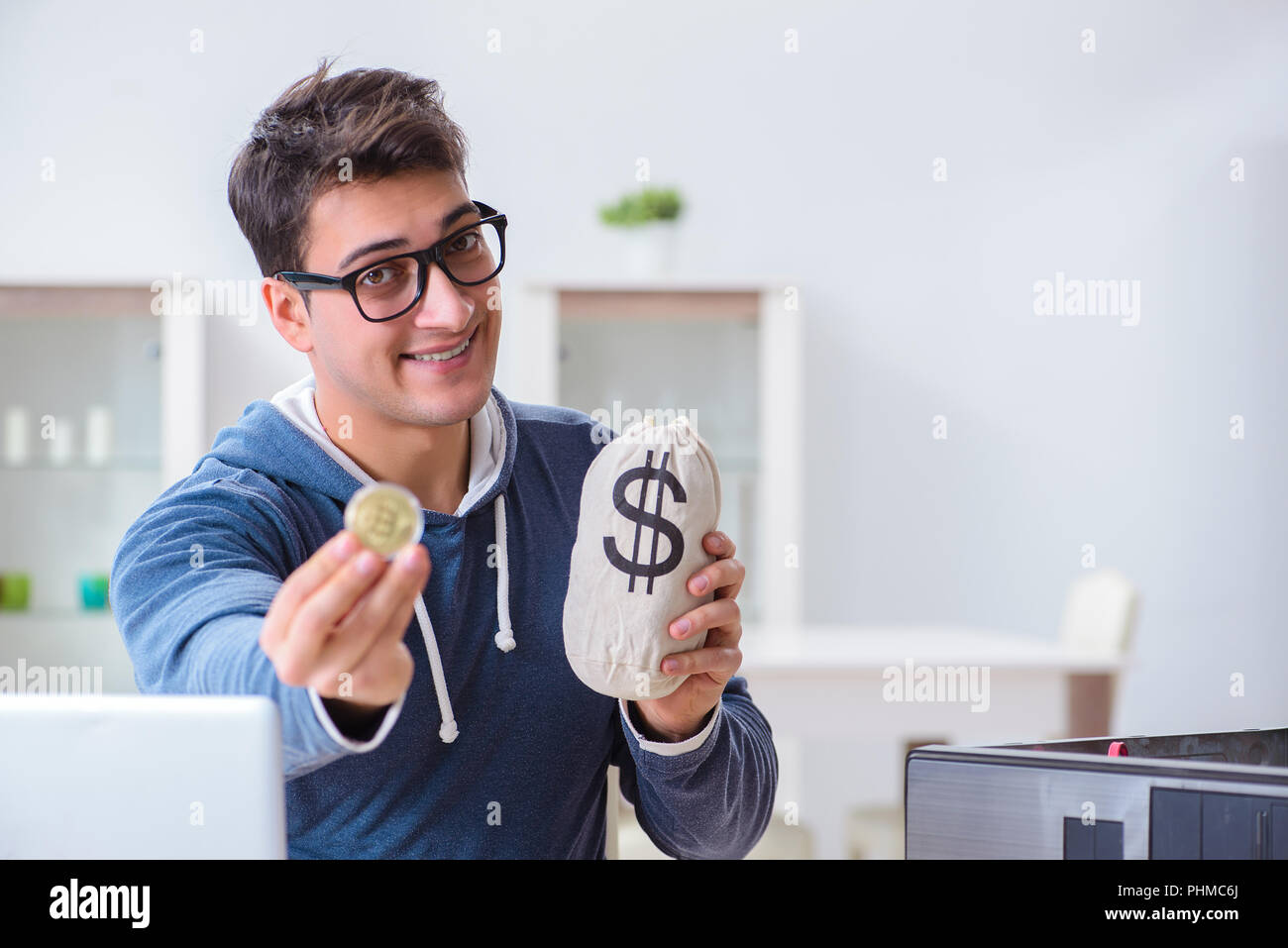 Young businessman bitcoin money bag hi-res stock photography and images ...