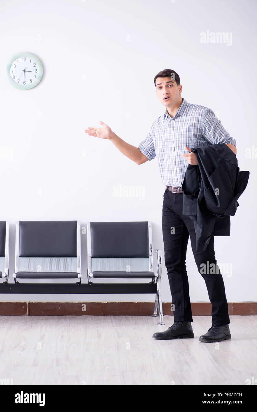 Man nervously impatiently waiting in the lobby Stock Photo - Alamy