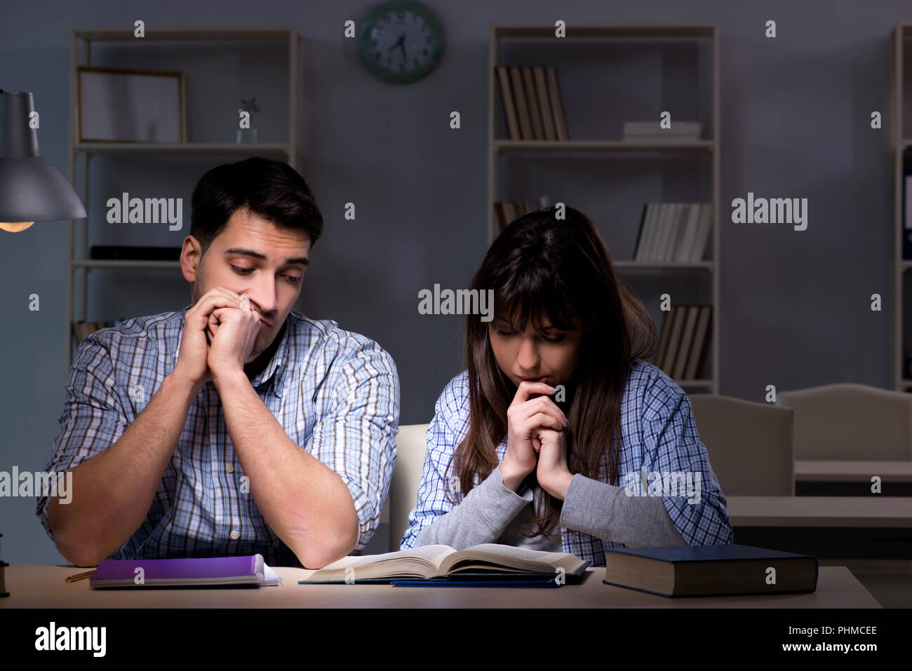 Two students studying late at night Stock Photo - Alamy