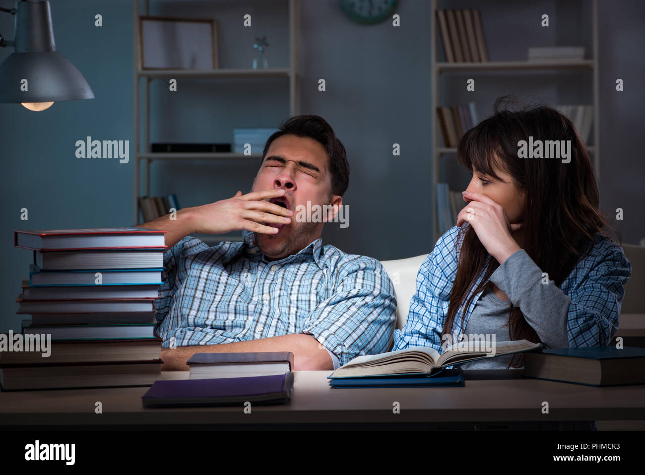 Two students studying late at night Stock Photo - Alamy
