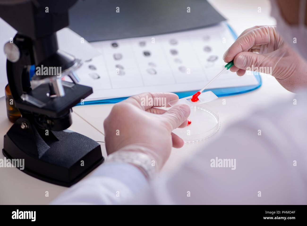 Drug synthesis lab experimentnig with pills Stock Photo - Alamy