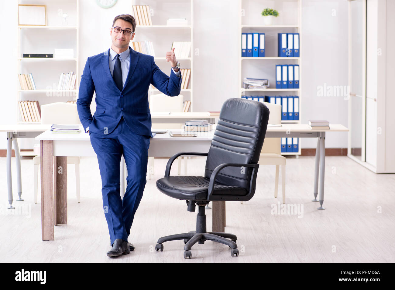 Young handsome businessman employee working in office at desk Stock ...