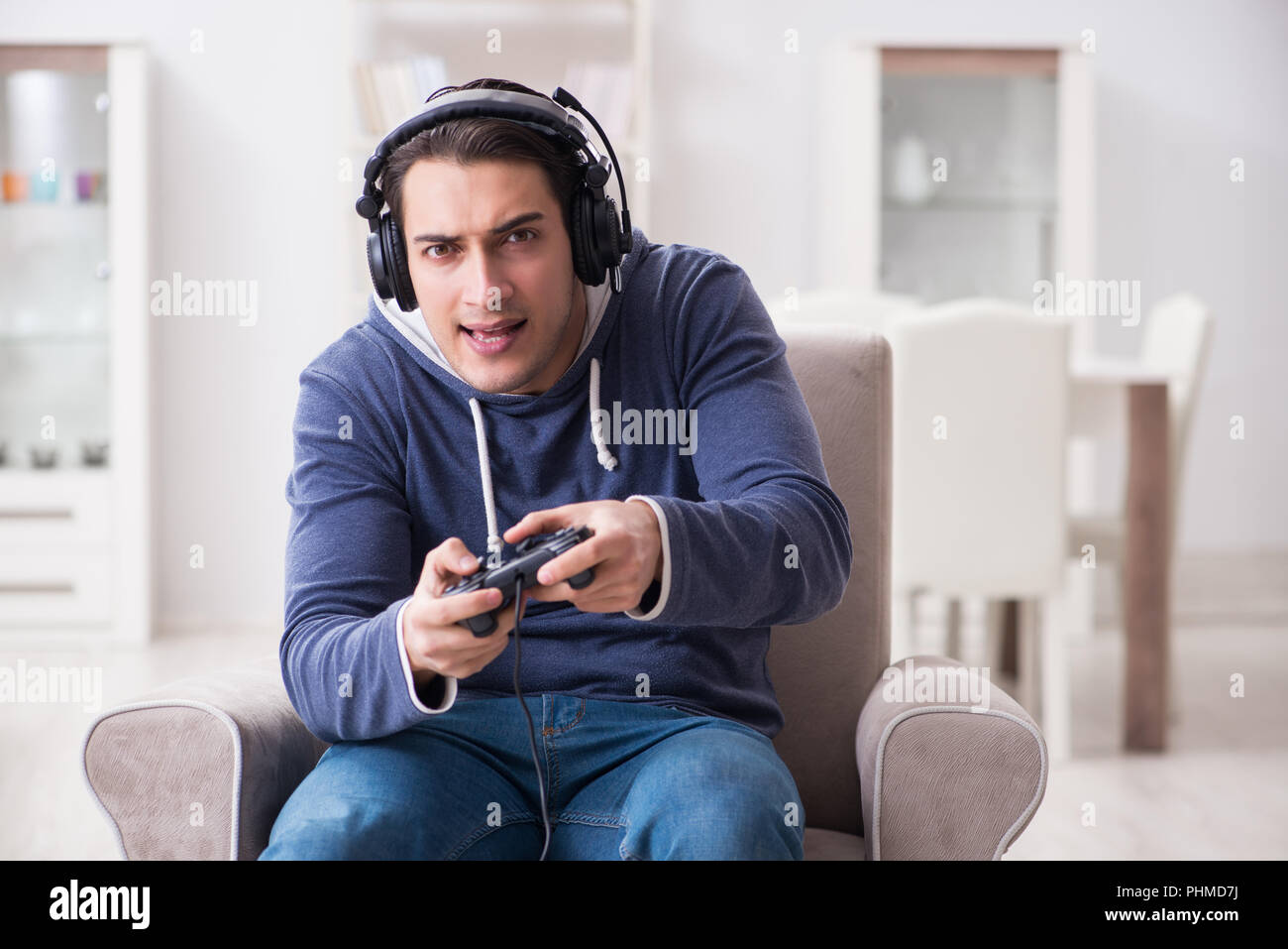 Young man playing computer games at home Stock Photo - Alamy