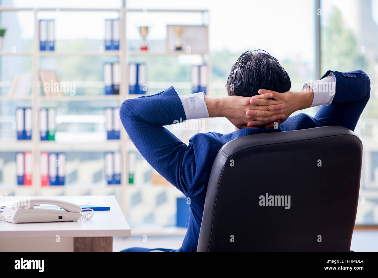 Young handsome businessman employee working in office at desk Stock ...