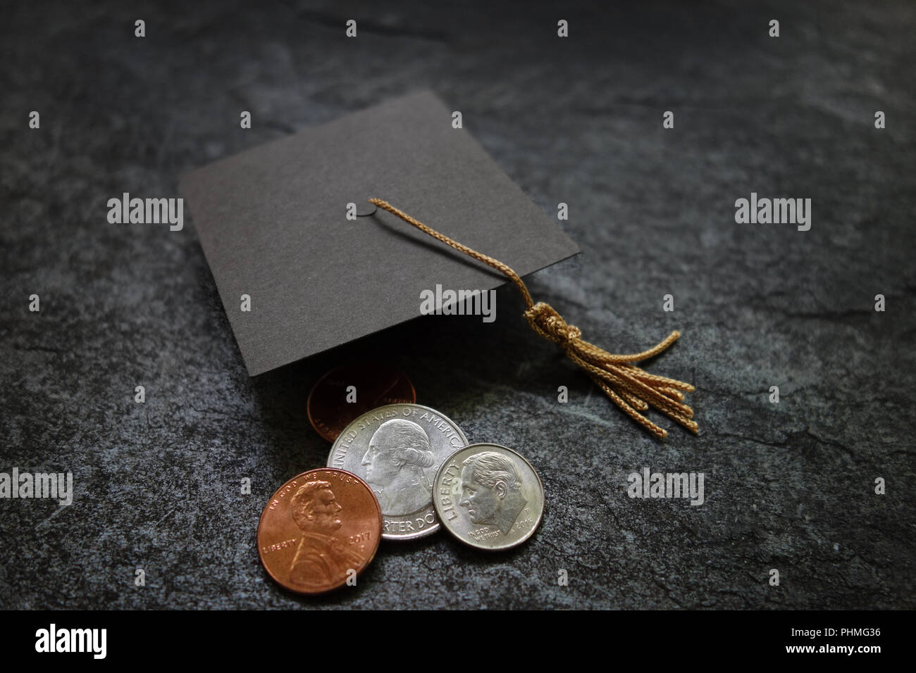 Graduation cap and coins Stock Photo - Alamy