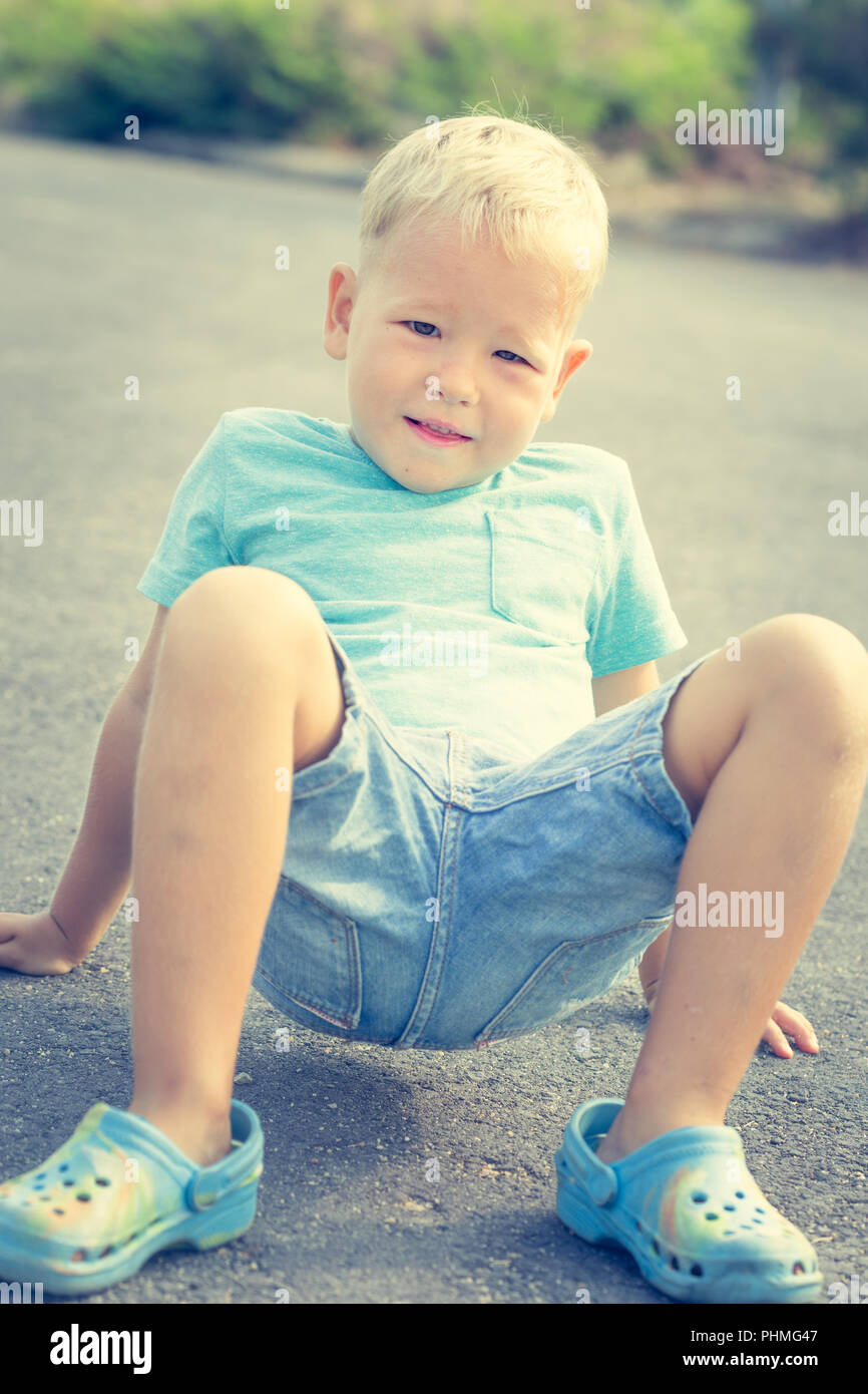 Child doing exercises outdoor Stock Photo - Alamy
