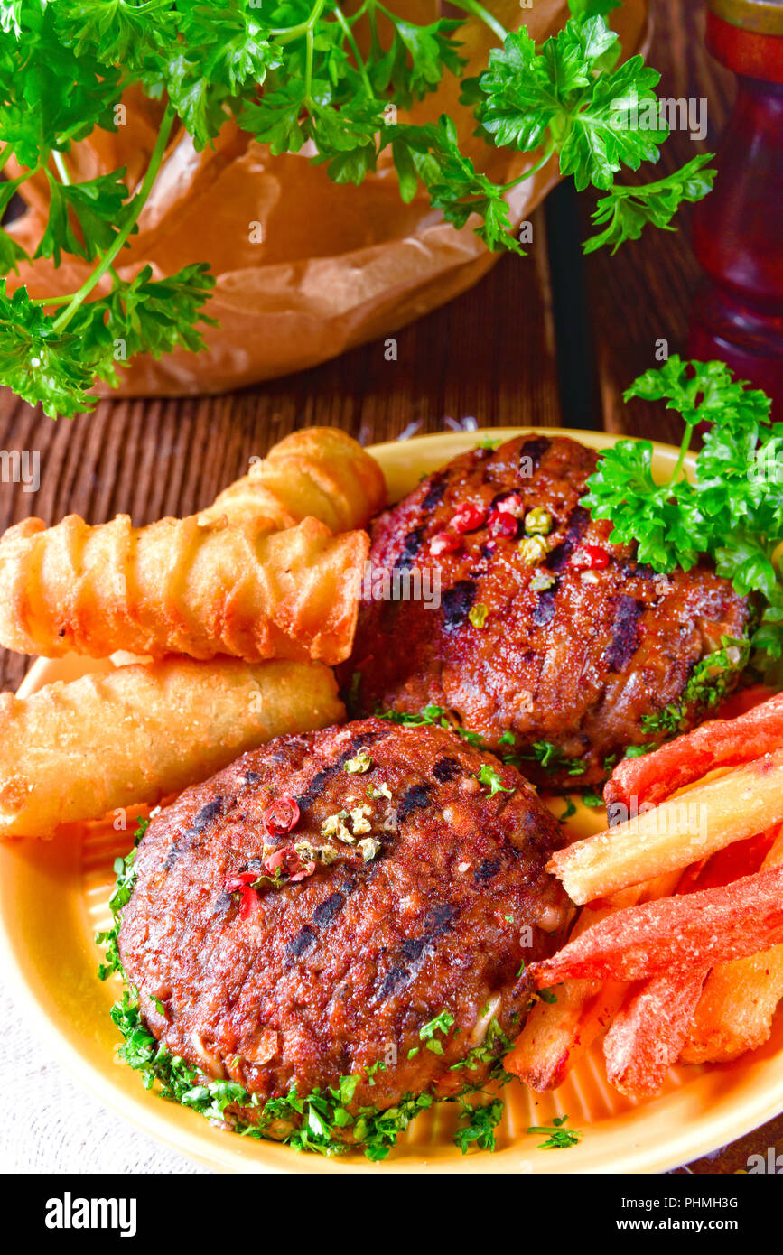 grilled bullets with croquettes and vegetables Stock Photo - Alamy
