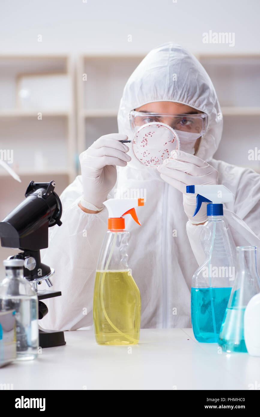 Chemist testing chemical substances in lab Stock Photo - Alamy