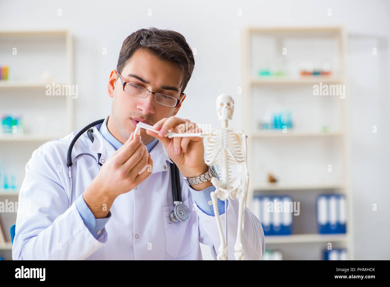 Doctor student studying the bones of skeleton Stock Photo - Alamy