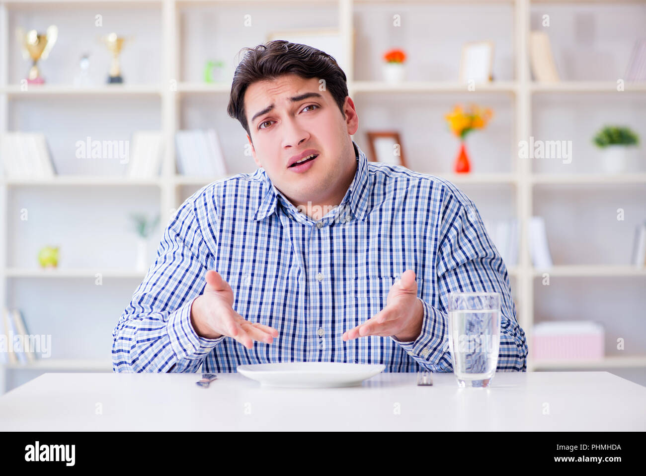 Angry man waiting food in hi-res stock photography and images - Alamy
