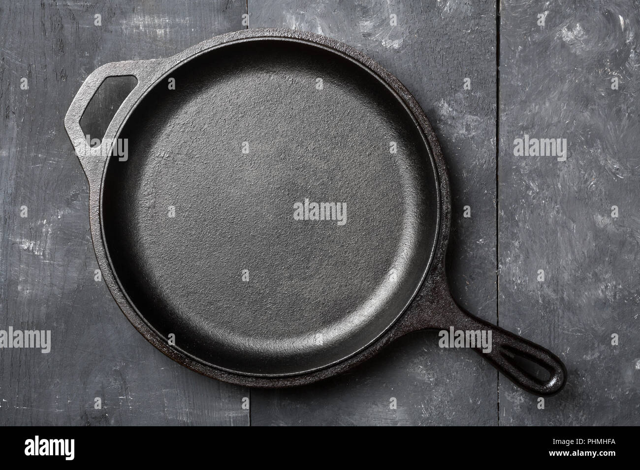 Empty, clean black cast iron pan or dutch oven top view from above on ...