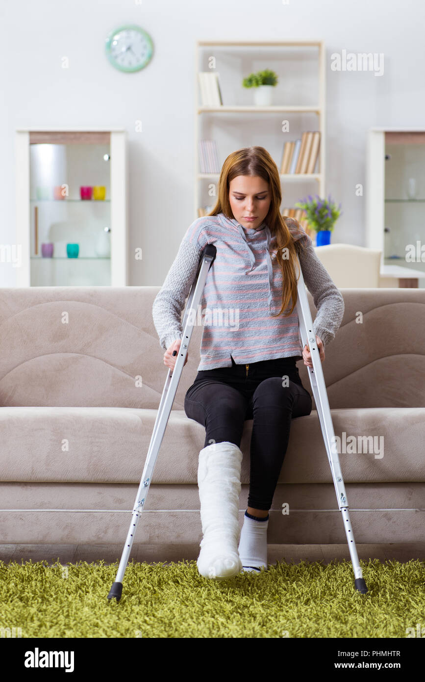 Young woman with broken leg at home Stock Photo - Alamy